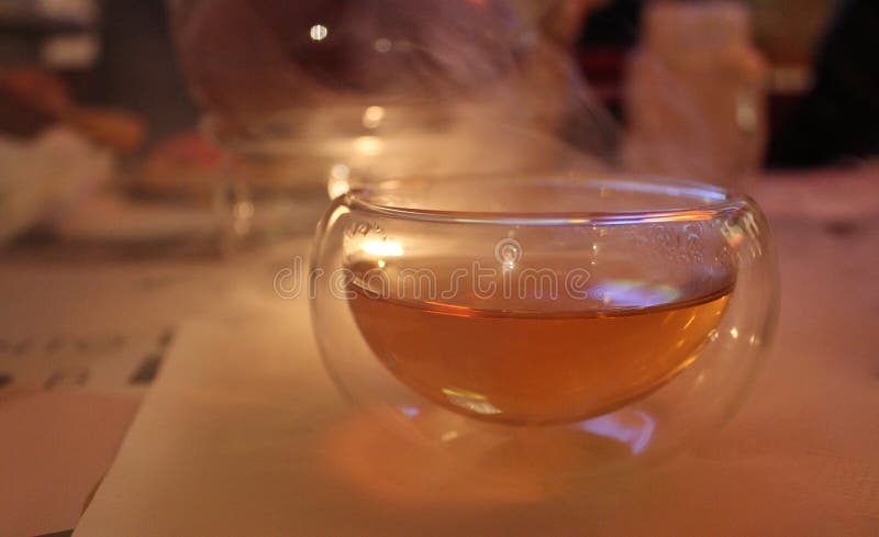 Tea in a Round Transparent Cup on a Orange Background Stock Image ...