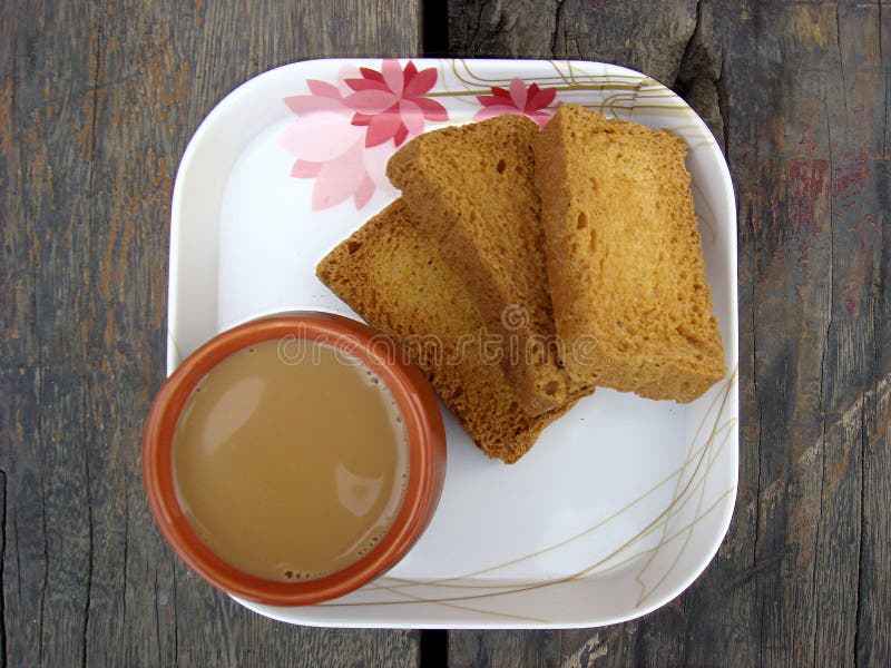 Tea and rusk in plate stock photo. Image of refreshment - 90355352