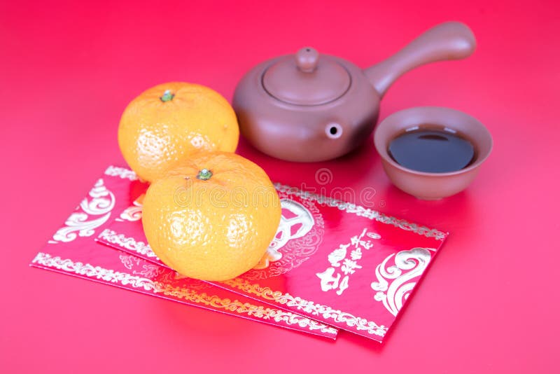 Tea Set and Red Packets and Oranges.the Chinese Characters in the ...