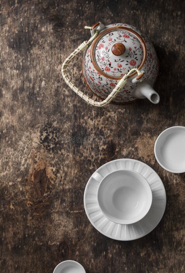 Tea Set on a Wooden Table, Top View. Teapot, Empty White Tea Cup on a ...