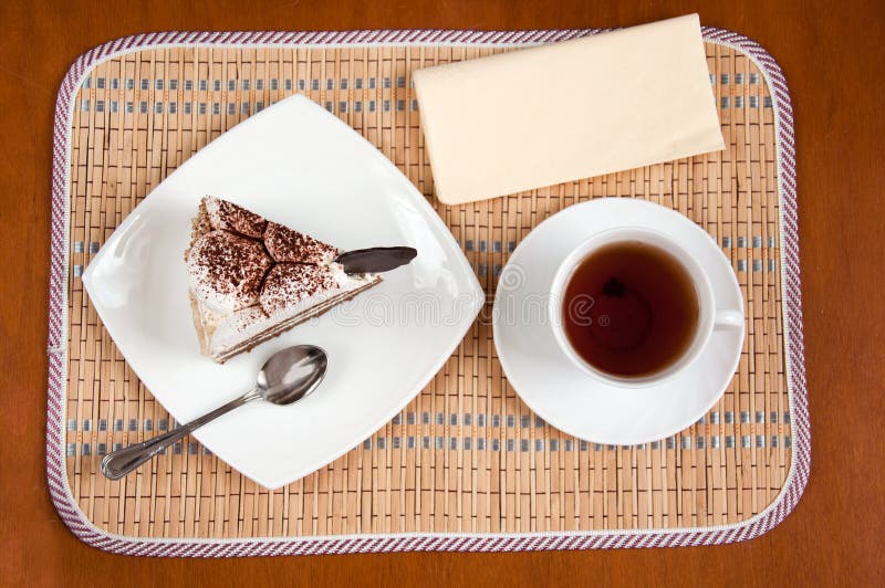 Tea and a slice of cake stock image. Image of spoon, cream - 19626335
