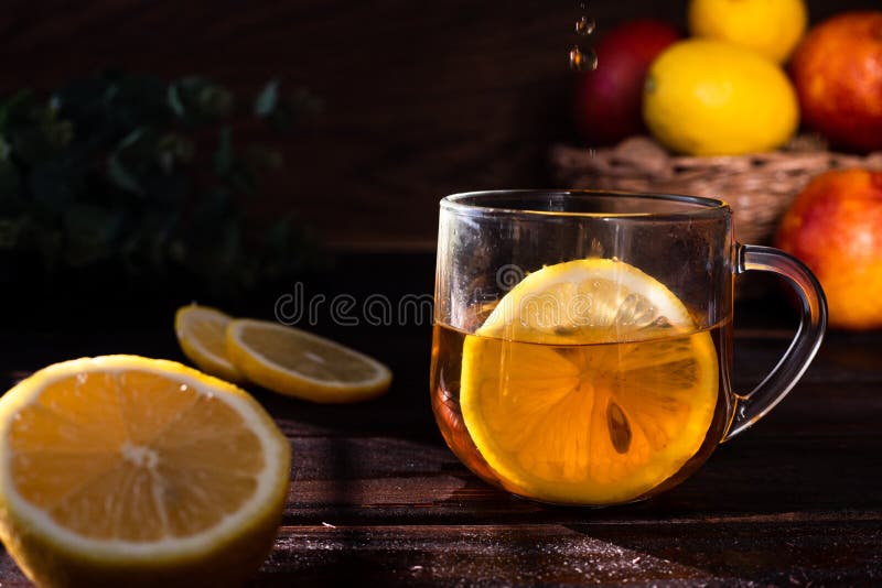 Tea is Splashed Out of a Dissold Mug with Tea Inside and Pieces of ...