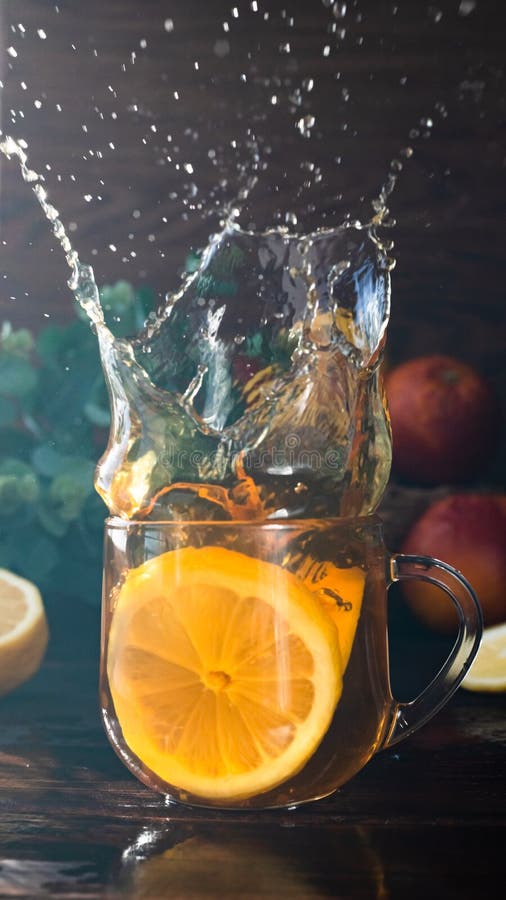 Tea is Splashed Out of a Dissold Mug with Tea Inside and Pieces of ...