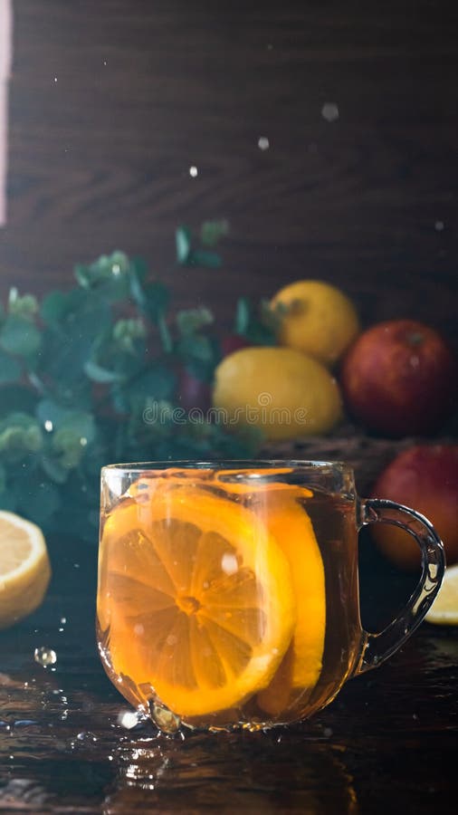 Tea is Splashed Out of a Dissold Mug with Tea Inside and Pieces of ...