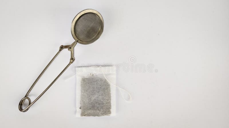 Tea Strainer and Tea Bag on White Background. Drinking Tea. Stock Image ...