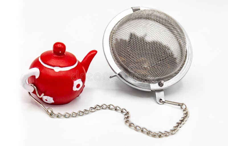 Tea Strainer with Tea Leaves Dropped in Glass Cup of Boiling Water ...