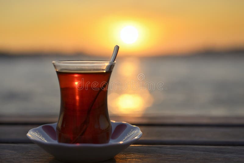 Tea and sunset stock photo. Image of sunset, table, water - 52604686