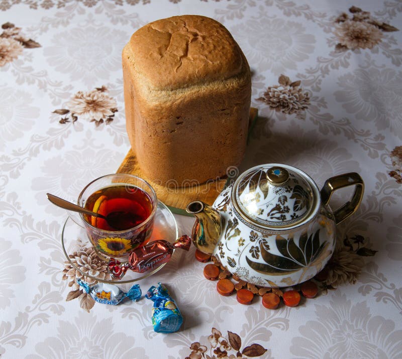 Tea with sweets and bread stock image. Image of tablecloth - 189582145
