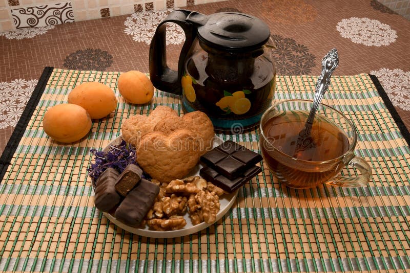 Tea with sweets and fruit stock photo. Image of food - 191501218