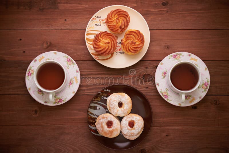 Tea and Sweets on a Wooden Table Stock Photo - Image of brown, tasty ...