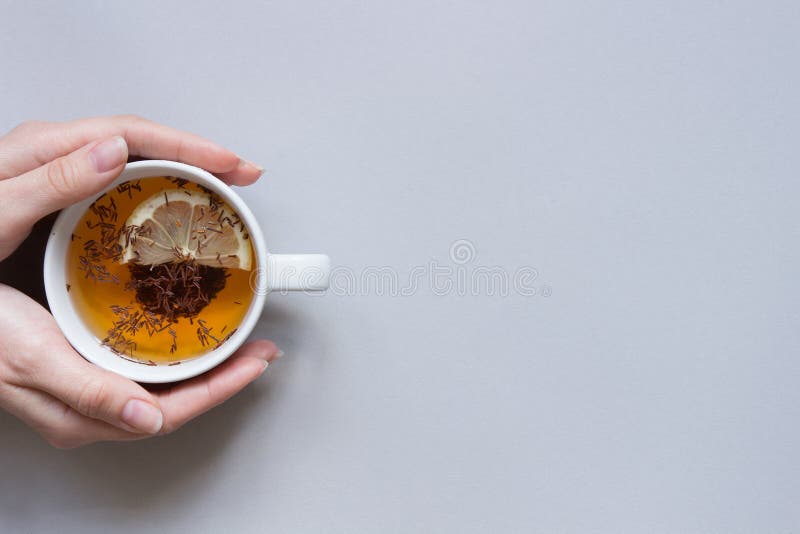 Tea Time. Hands Holding Cup of Hot Black Tea on the Blue Background ...