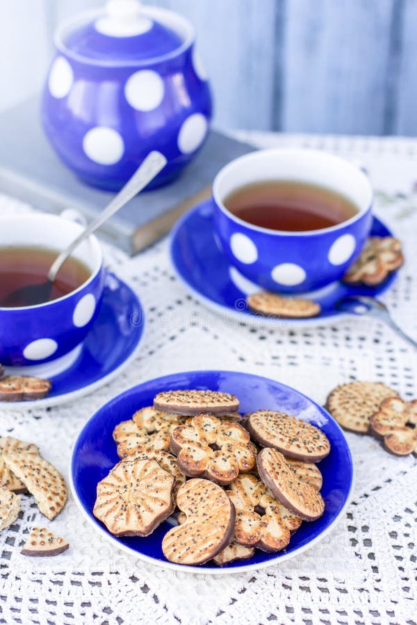 Tea Time on Rustic Table with Chocolate Poppy Seed Cookies Stock Photo ...