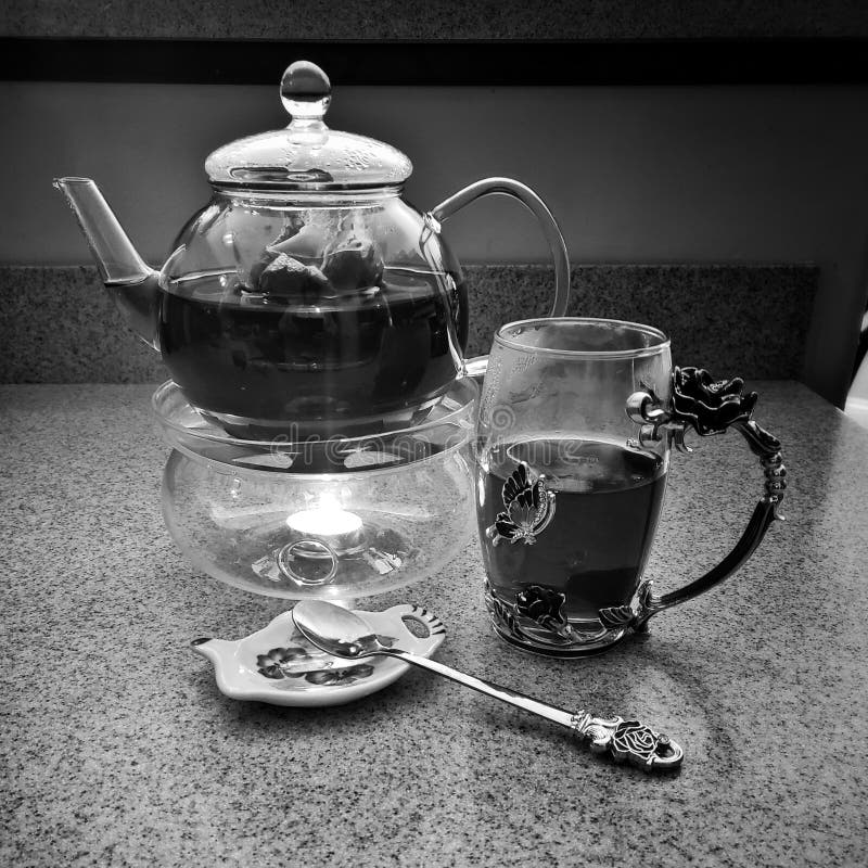 Tea Time Glass and Teapot stock image. Image of lighting - 244194459