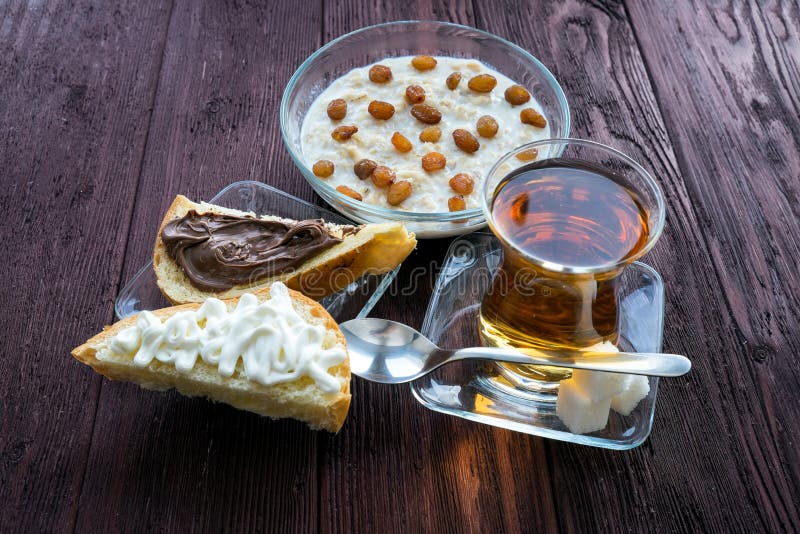 Tea and toast wooden table stock photo. Image of delicious - 186543610