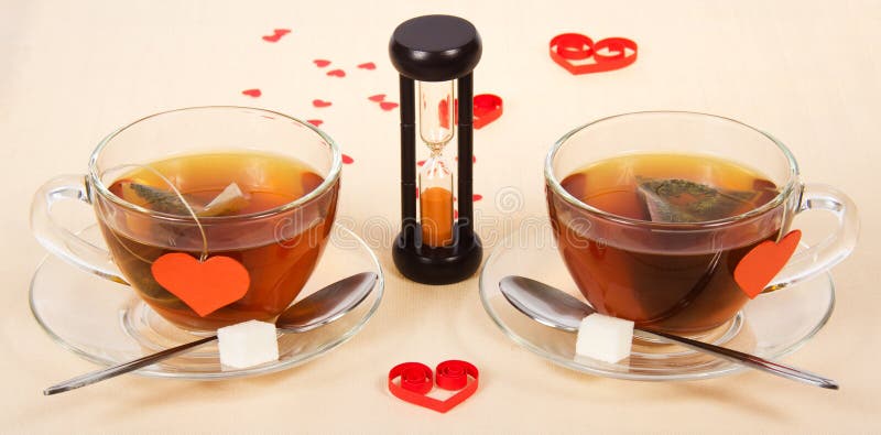 Tea for two and hourglass stock photo. Image of napkin - 35376998