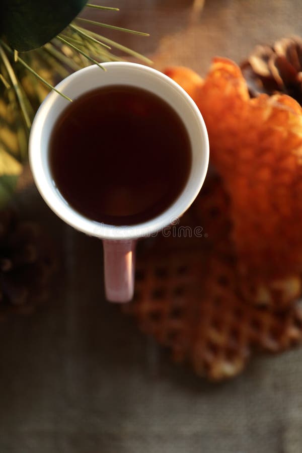 Tea and waffle at sunset stock photo. Image of waffle - 83139792