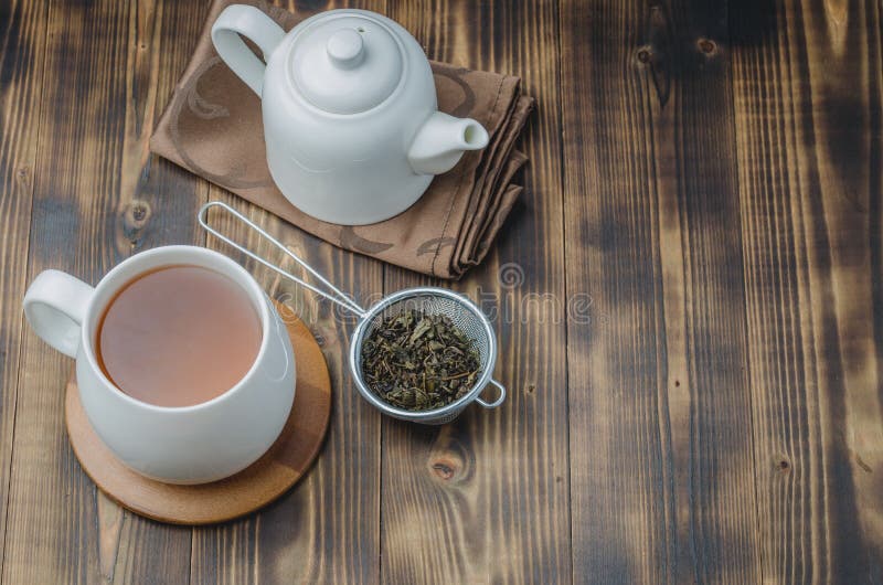 Tea. White Cup of Tea, Dry Teas and Teapot Ona Wooden Table Stock Photo ...