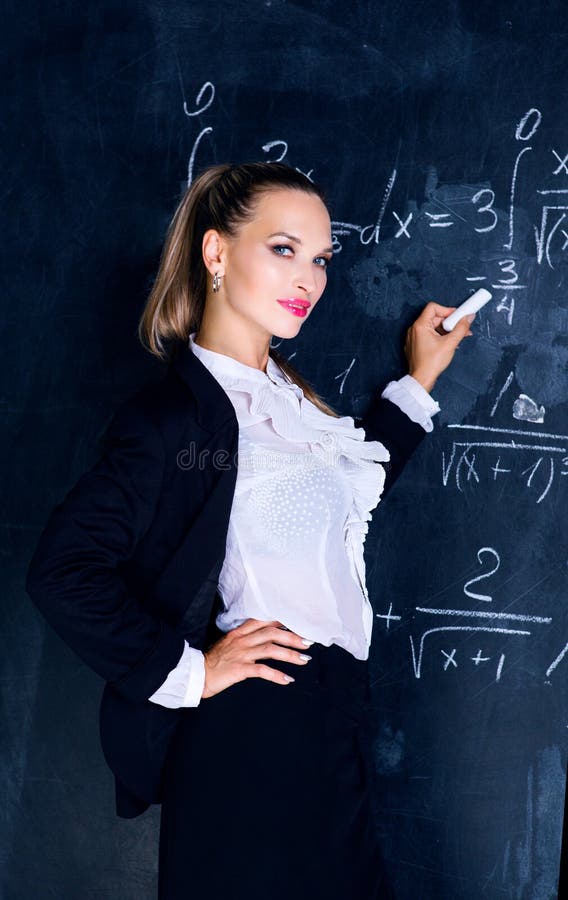 Teacher Against a Chalkboard Stock Image - Image of imperious, body ...