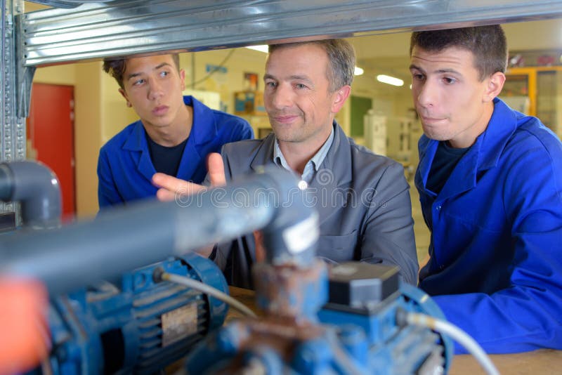Teacher Assessing Students ` Work Not Impressed Stock Image - Image of ...
