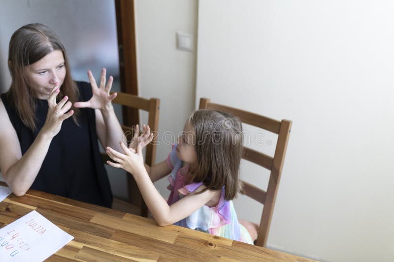 Teacher and Student Communicating Using Sign Language at Home Stock Image - Image of girl ...
