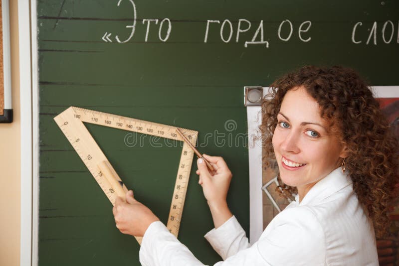 Teacher ruler behind desk stock photo. Image of college - 17042608