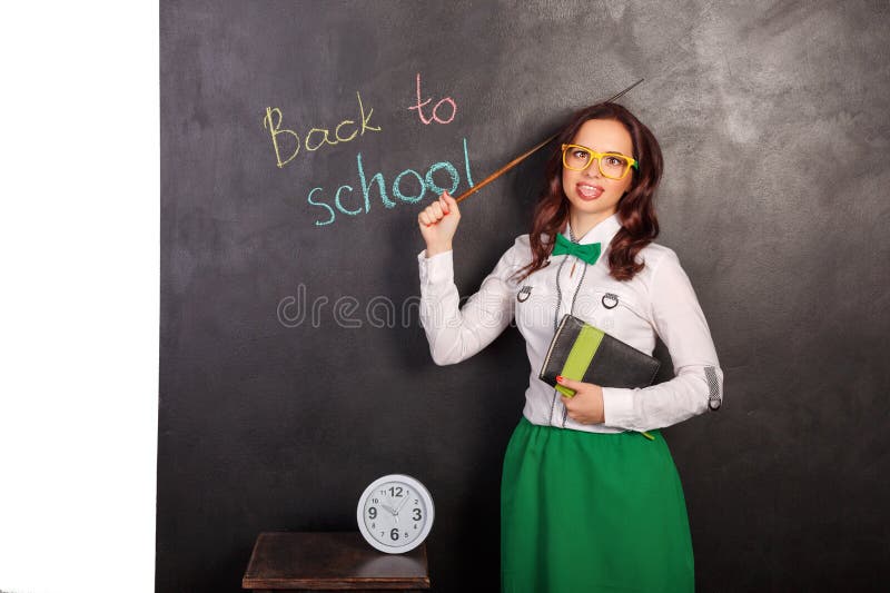 Teacher at the blackboard stock photo. Image of college - 95704084