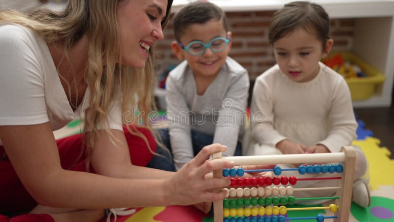 Teacher with Boy and Girl Playing with Maths Puzzle Game Sitting on ...