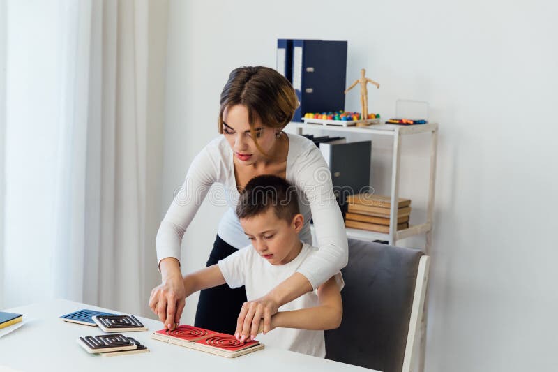 Teacher with Boy in School Training Development Stock Photo - Image of ...