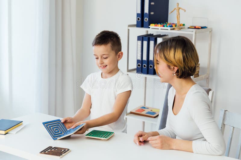 Teacher with Boy in School Training Development Stock Image - Image of ...