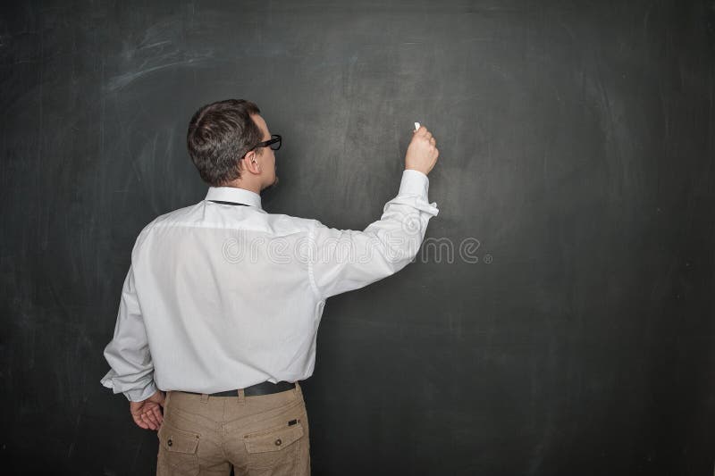 Teacher with Chalk Writing Something on Empty Blackboard Background ...