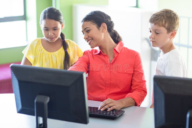 Teacher with Children in Computer Class Stock Image - Image of class ...