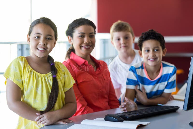 Teacher with Children in Computer Room Stock Image - Image of ...