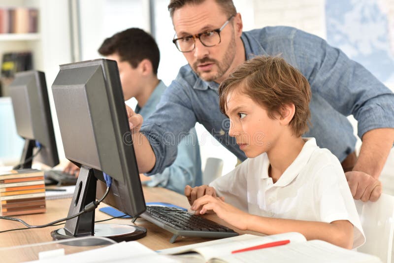 Teacher with Children in Computing Class Stock Image - Image of desktop ...
