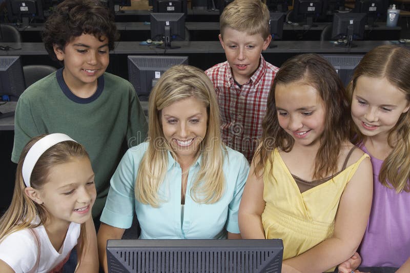 Elementary Students Working at Computers in Classroom Stock Photo ...