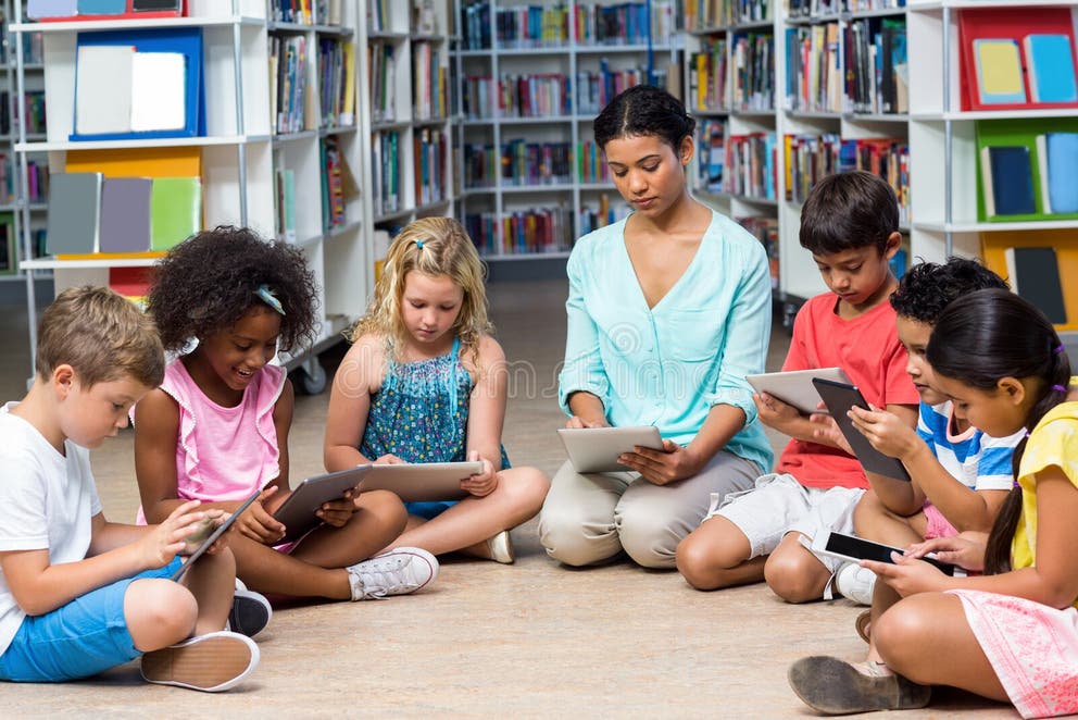 Teacher with Children Using Digital Tablet Stock Image - Image of ...