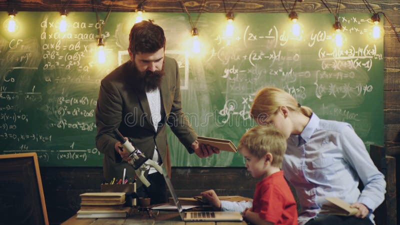 Teacher in Classroom. Difficult Learning Process. Teachers are Trying ...