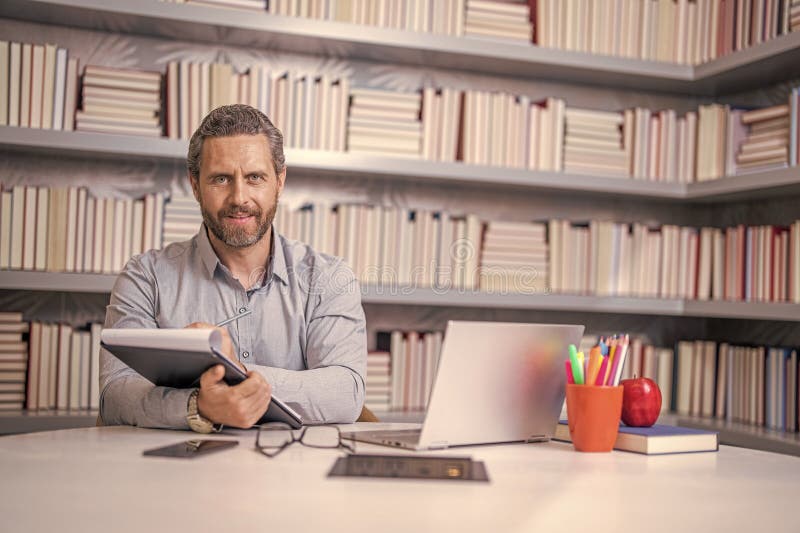 Teacher in Classroom. School Tutor Book in Classroom. Man on Lesson in ...