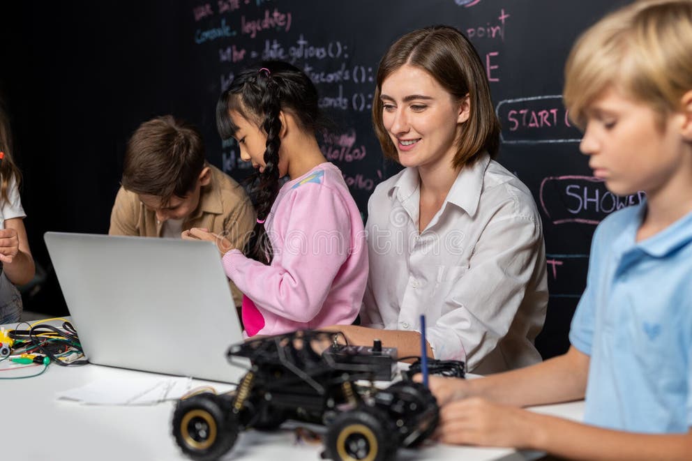 Teacher Demonstrate Attentive Children To Code Robots in STEM Class ...
