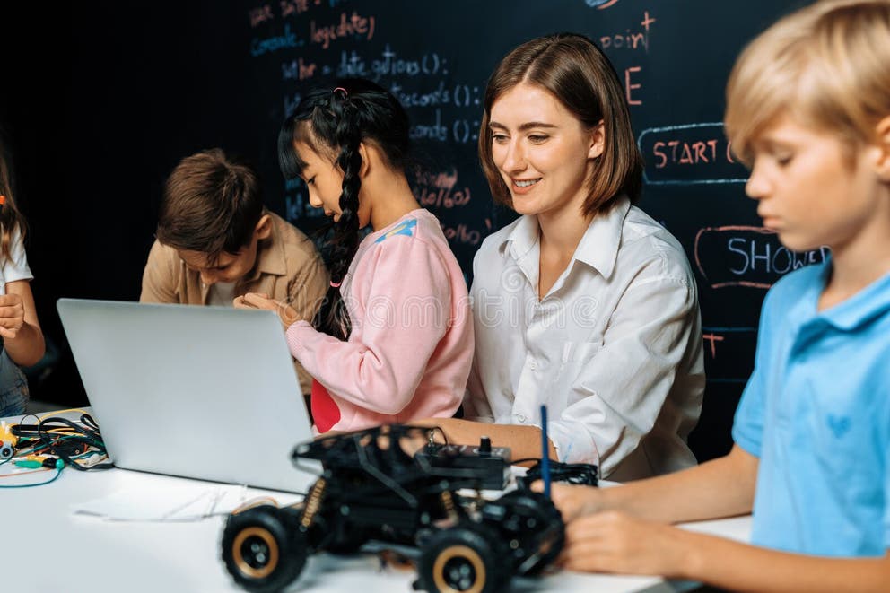Teacher Demonstrate Attentive Children To Code Robots in STEM Class. Erudition. Stock Image ...
