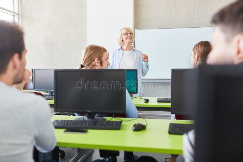 Teacher in computer course stock photo. Image of lecturer - 100222654