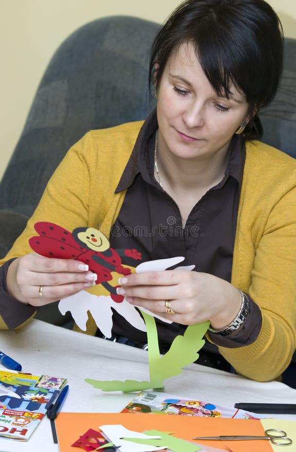 Teacher cutting out shapes stock image. Image of professional - 8541877