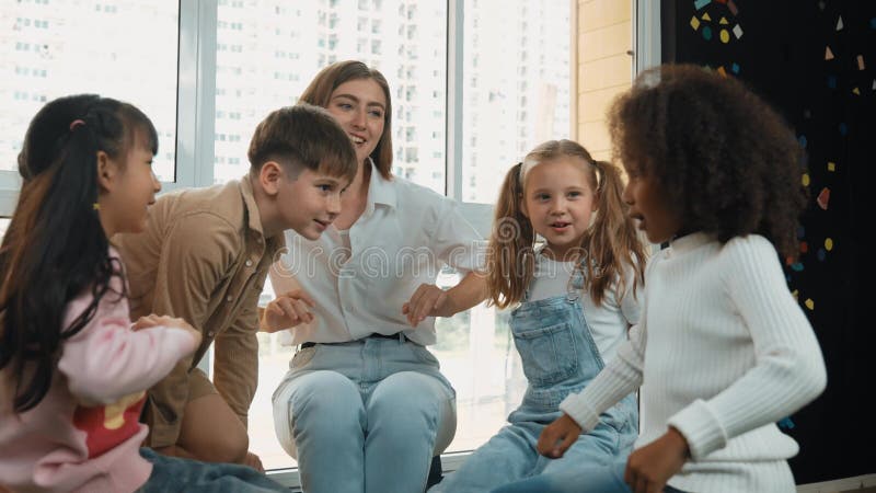 Teacher and Diverse Students Putting Hands Together at Classroom ...