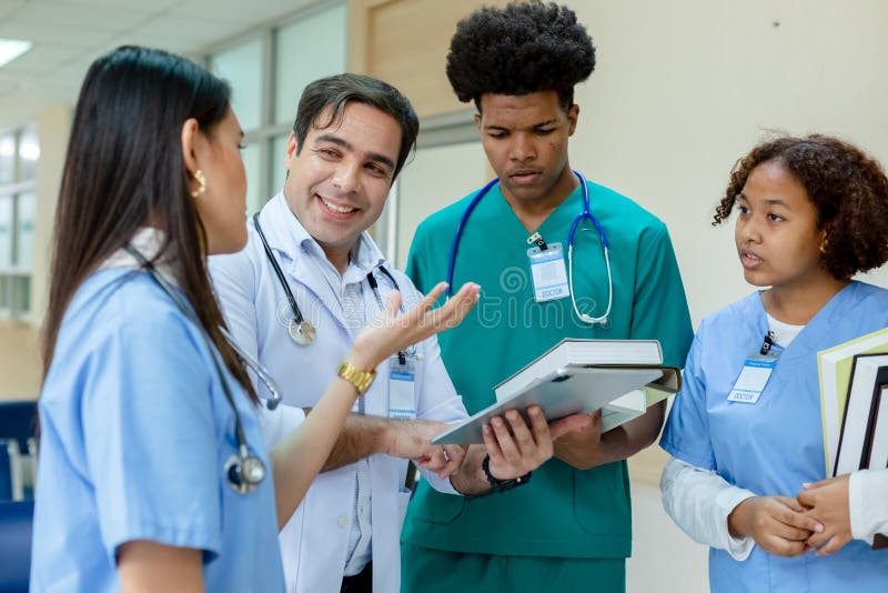 Teacher Doctor Man and Group of Medical Student Standing Looking Work ...