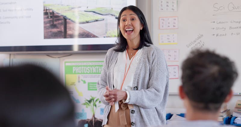 Teacher, Education and Woman Answer Question of Children in Classroom ...