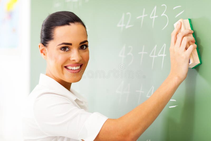 Teacher erasing chalkboard stock photo. Image of green - 29287576