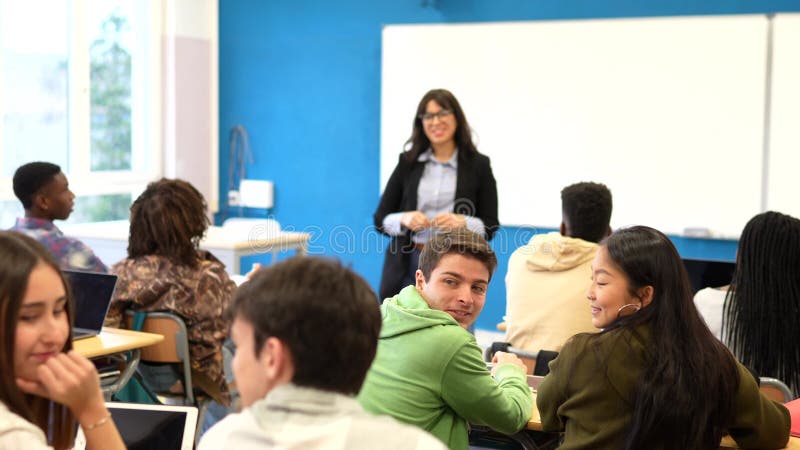 Teacher Explaining Lesson To Diverse High School Students Stock Footage ...
