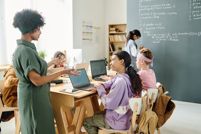 Teacher Explaining Material To Students Stock Photo - Image of woman ...