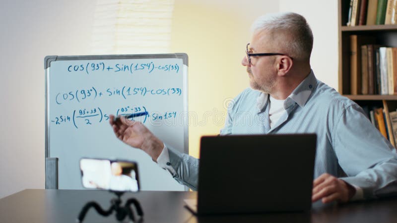 Teacher Explaining Mathematics Concepts during an Online Lesson at Home ...