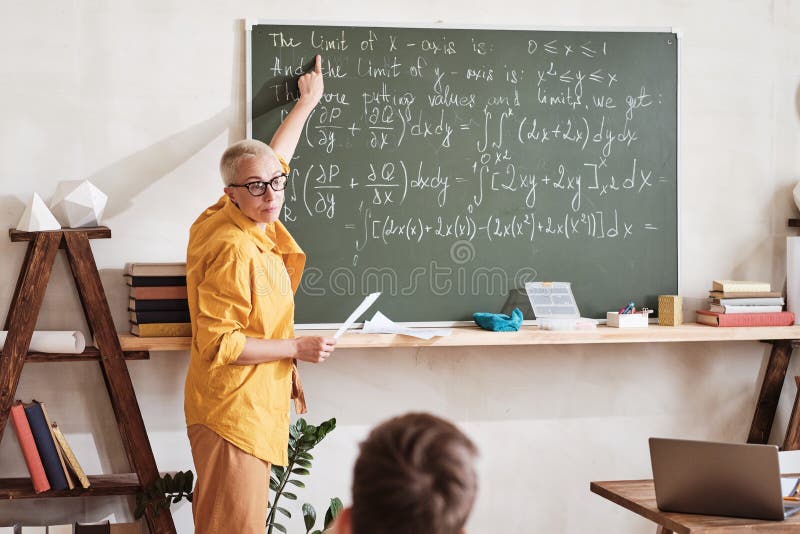 Teacher Explaining the Maths at School Stock Photo - Image of desk ...