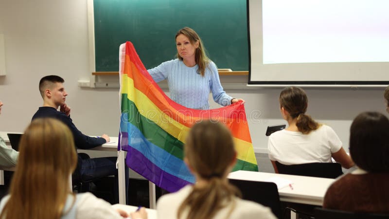 Teacher Explaining Meaning of LGBT Flag To Students in School Stock ... Teacher Explaining Meaning of LGBT Flag To Students in School Stock ...